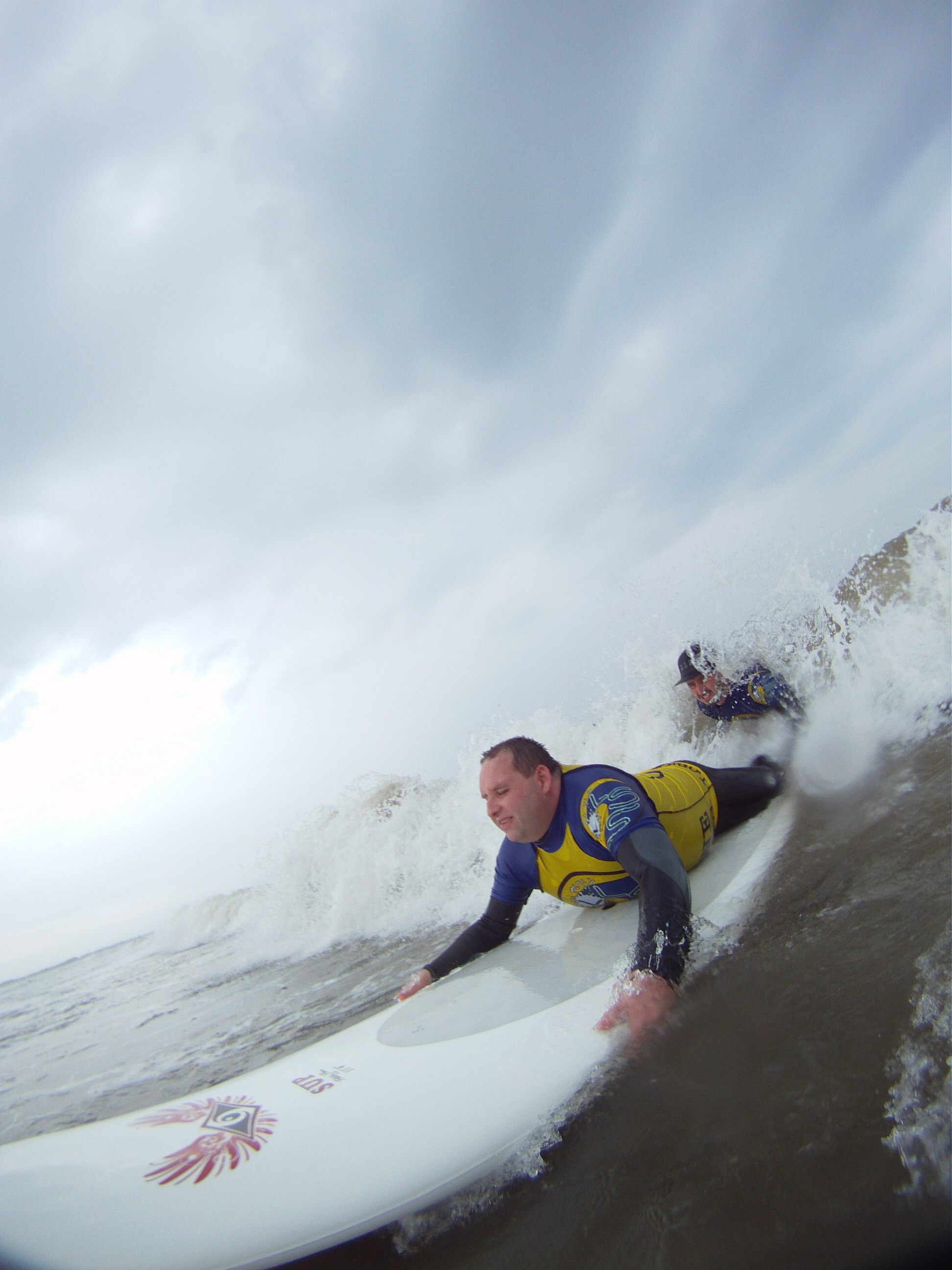 Brian surfing for Guide Dogs support - Long Line Surf School